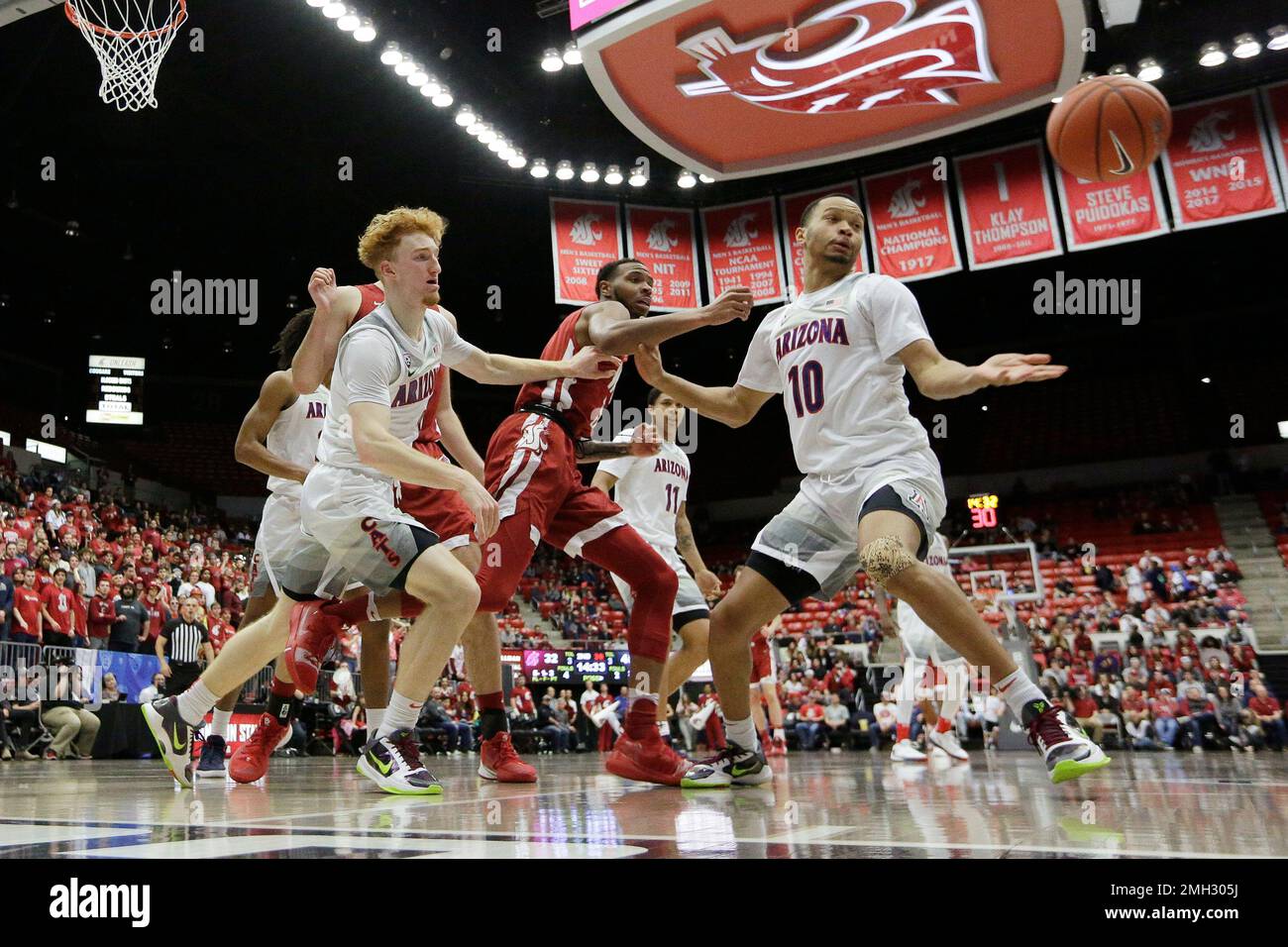 Arizona guard Nico Mannion, left, and guard Jemarl Baker Jr., right ...