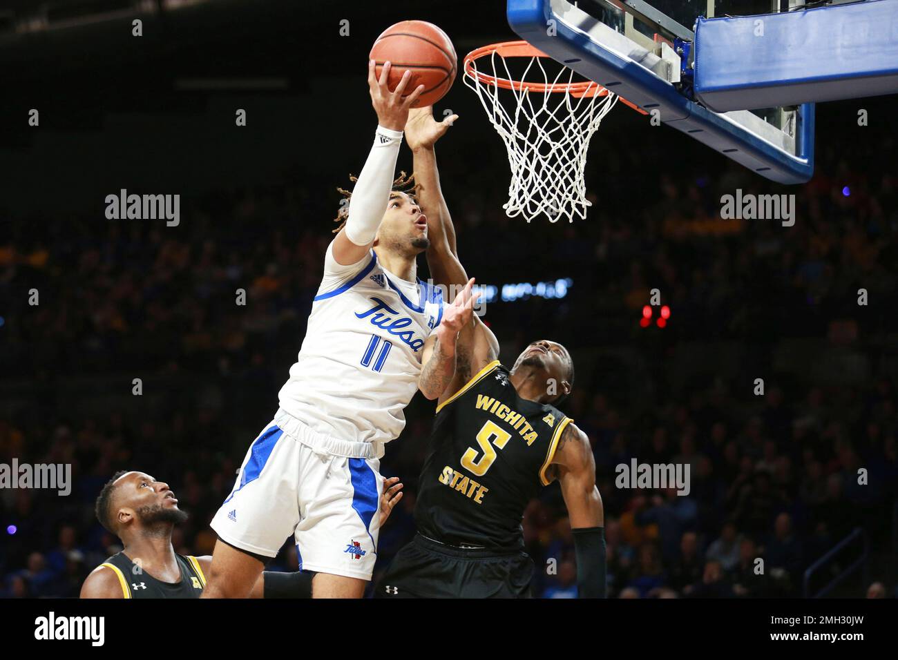 Tulsa guard Darien Jackson (11) gets fouled by Wichita State forward ...