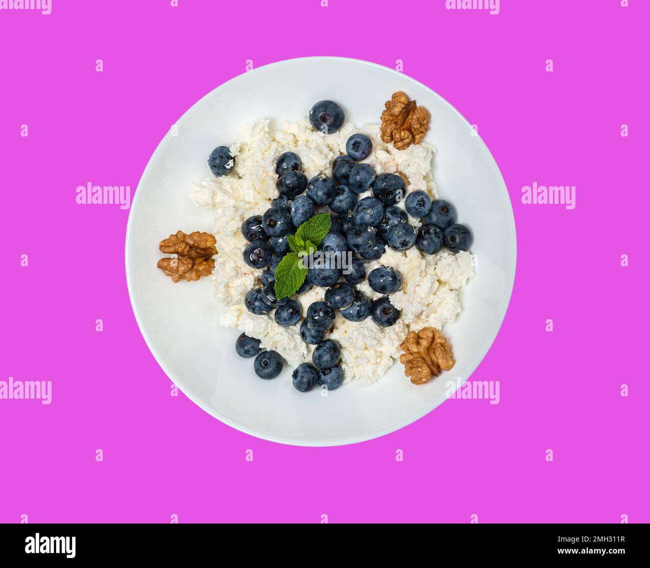 Healthy vegetarian food oatmeal with fresh blueberry nuts on isolated ...