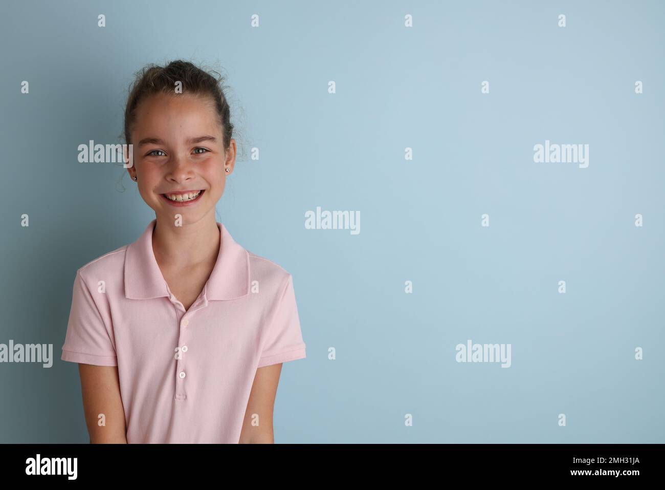 Little emotional teenage girl in pink shirt 11, 12 years old on an ...