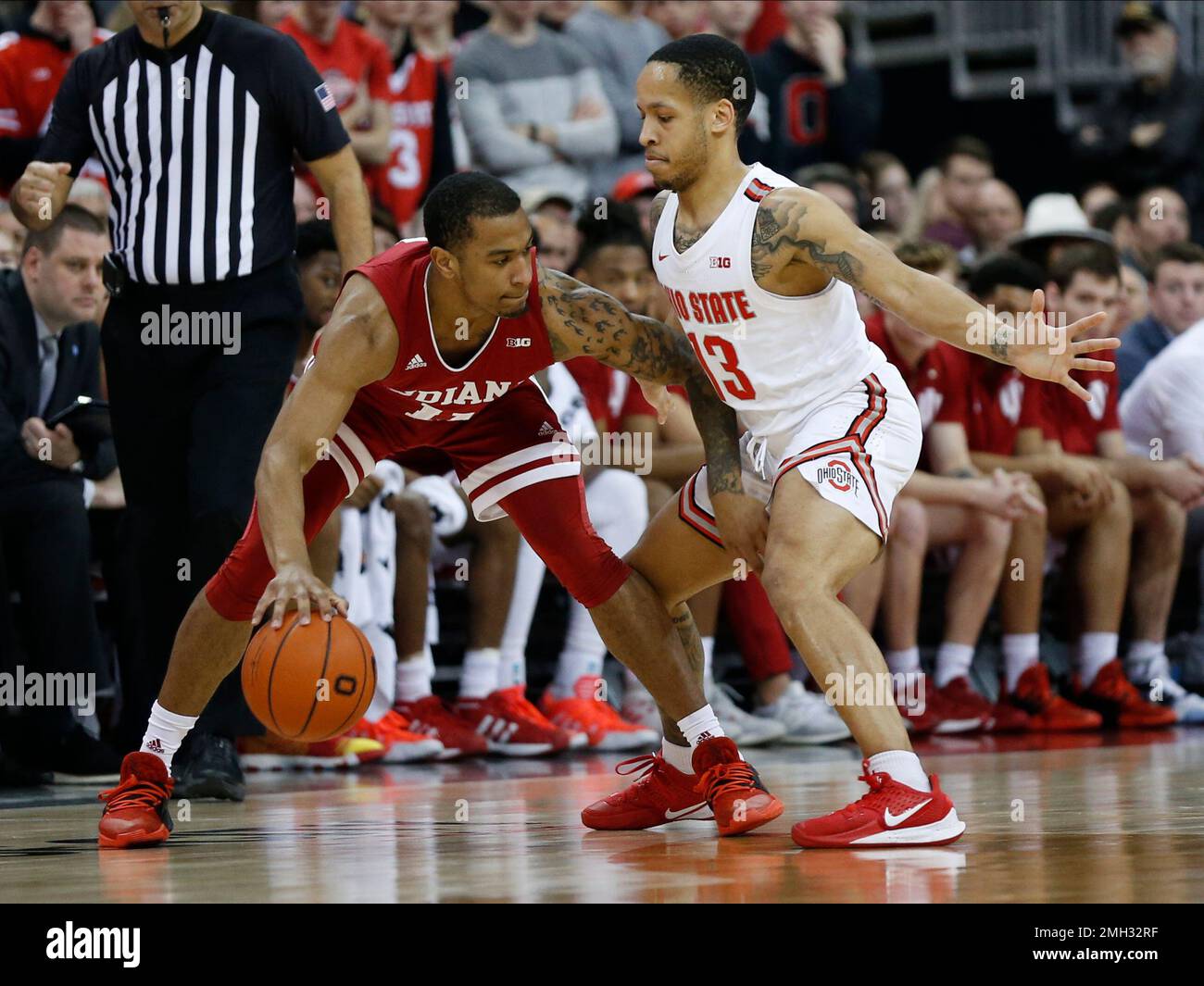 Indiana's Devonte Green, left, looks for an open pass as Ohio State's C ...