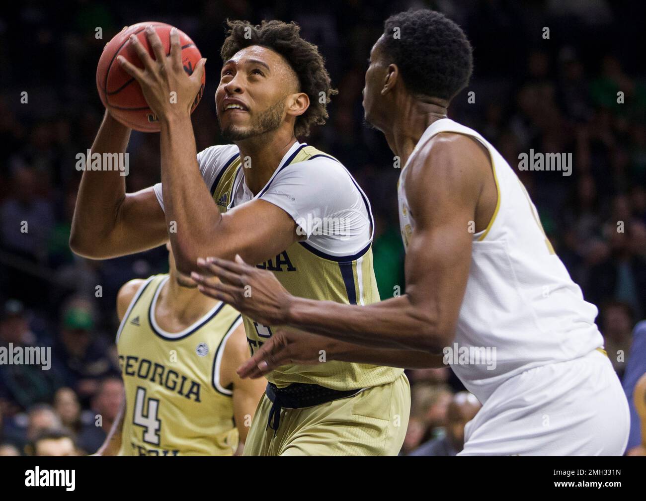 Georgia Tech's James Banks III, left, looks for a shot next to Notre ...