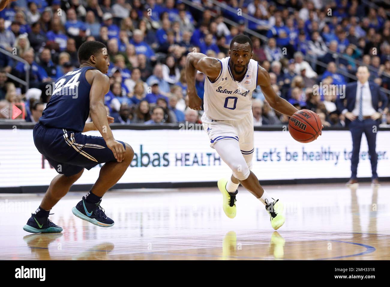Seton Hall's Quincy McKnight (0) drives to the basket against Xavier's ...