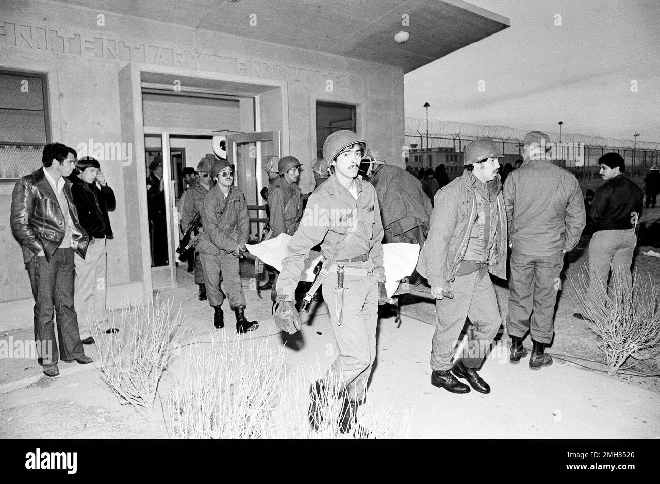 FILE - In this Feb. 3, 1980 file photo National Guardsmen carry the ...