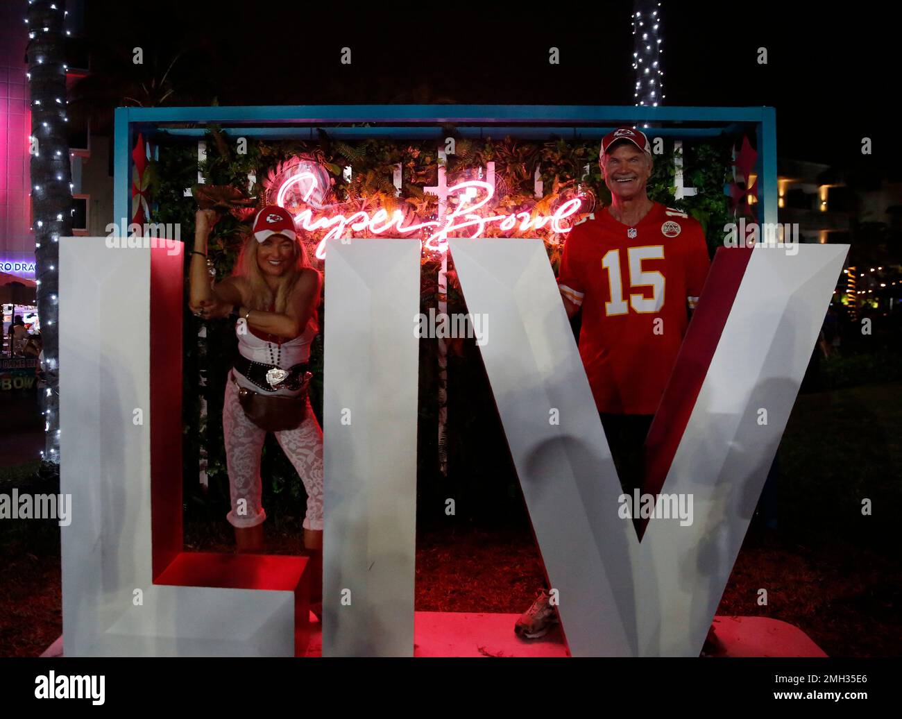 Kansas City Chiefs fans Gary and Jina Hosack, pose next to an NFL ...