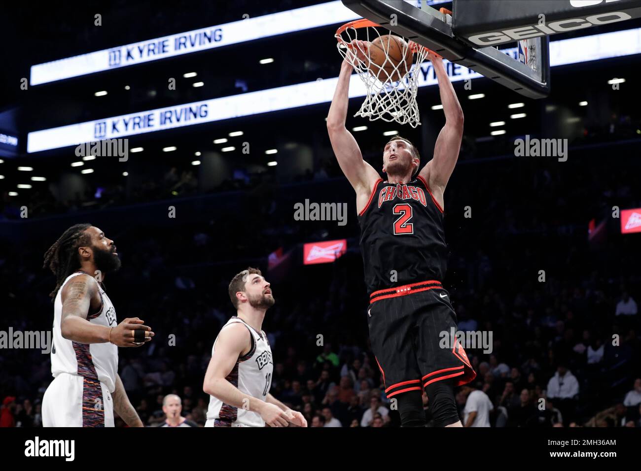 Chicago Bulls' Luke Kornet (2) dunks in front of Brooklyn Nets' Joe ...