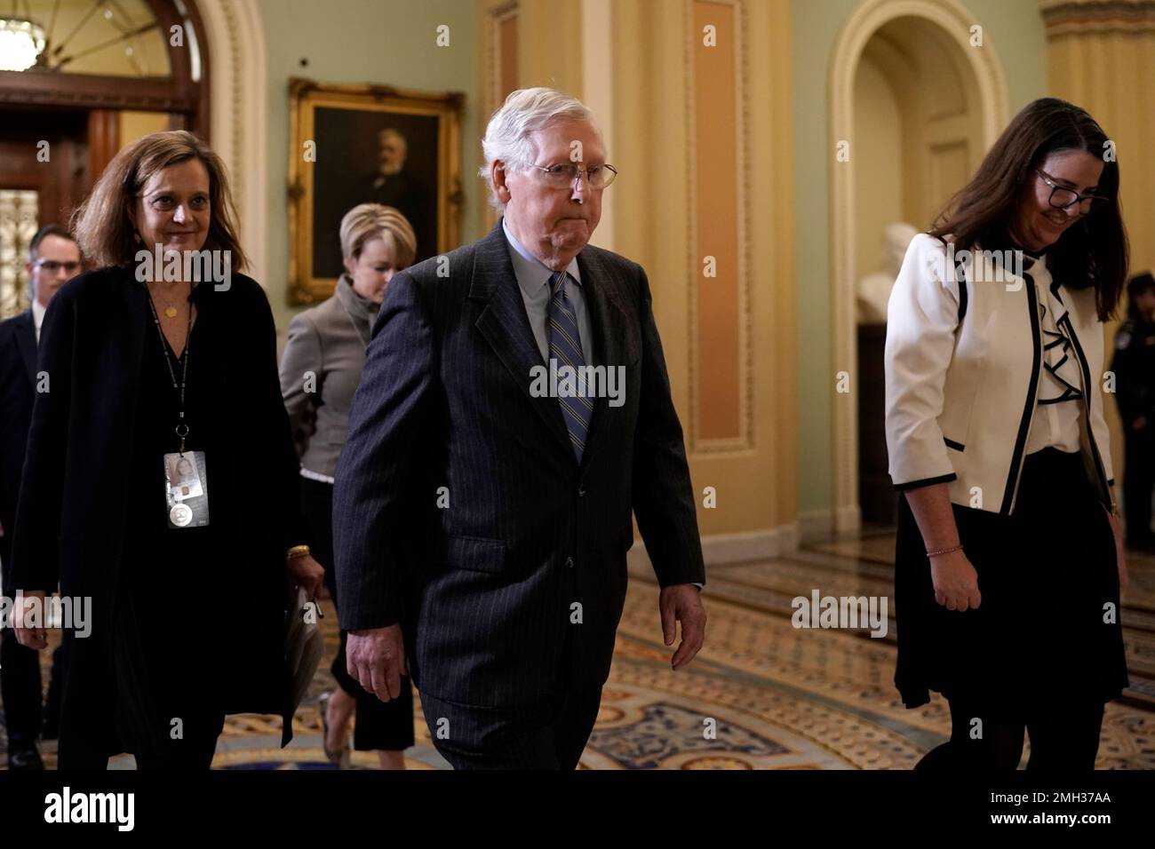 Senate Majority Leader Mitch McConnell, R-Ky., accompanied by his chief ...