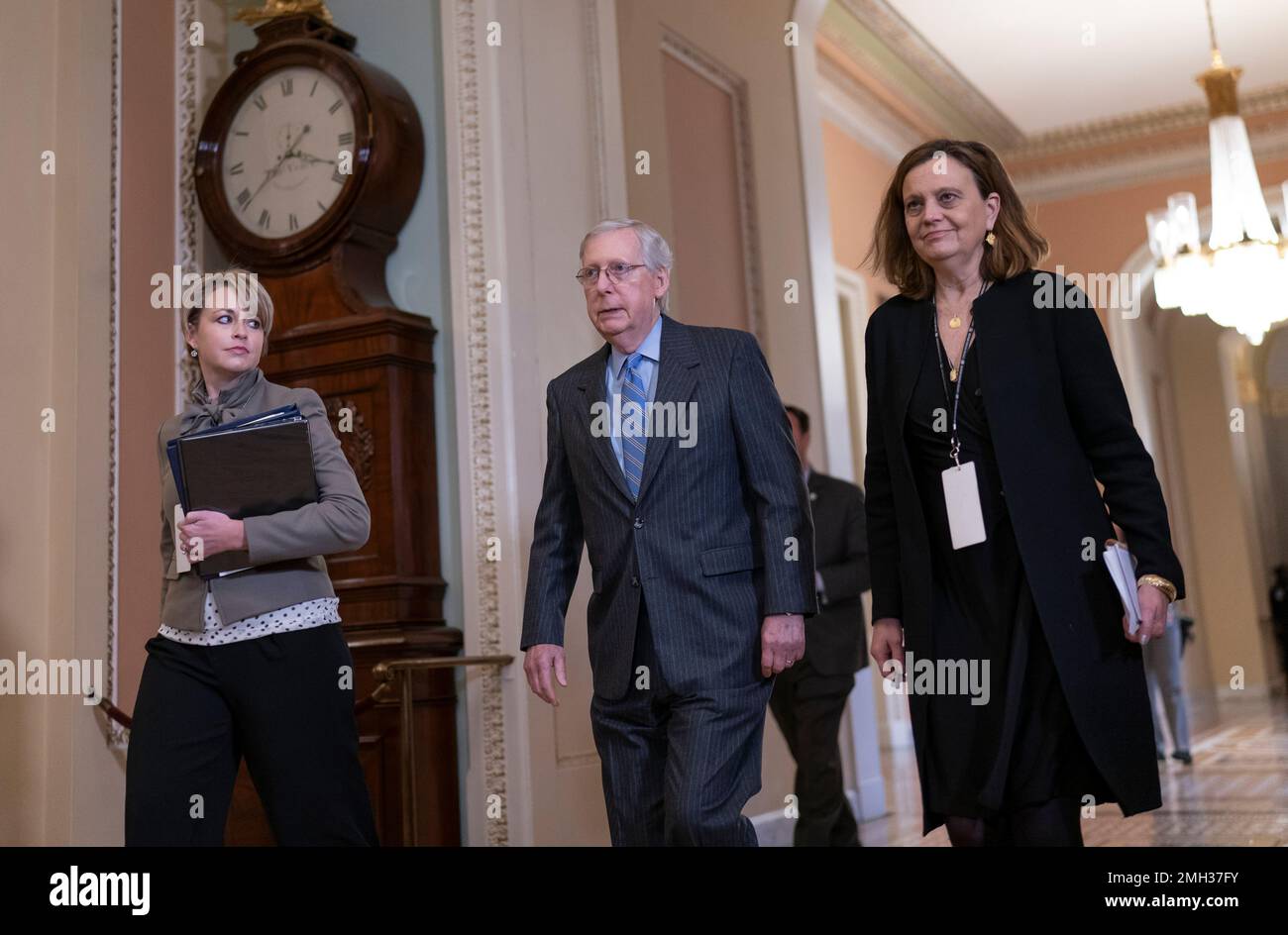 Senate Majority Leader Mitch McConnell, R-Ky., accompanied by aide ...