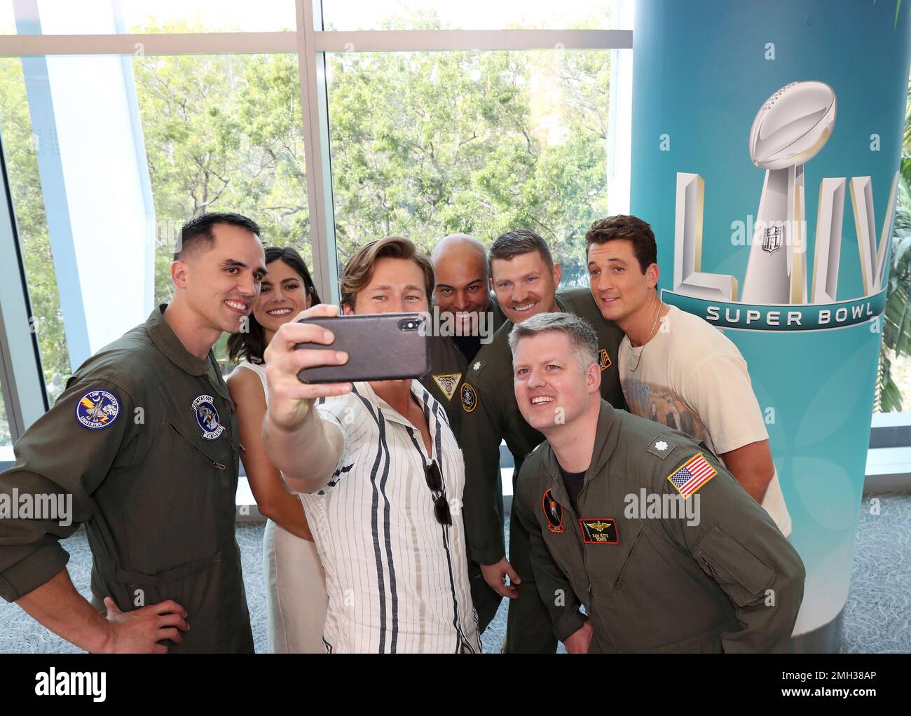 'Top Gun: Maverick' actors, Glen Powell, center, Miles Teller, right ...