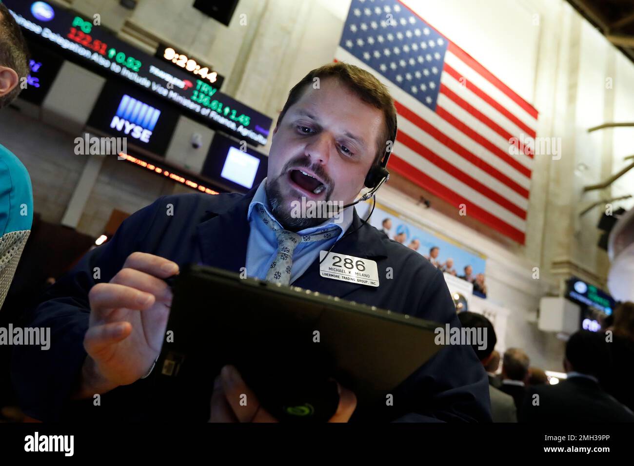 FILE - In this Jan. 9, 2020, file photo trader Michael Milano works on ...