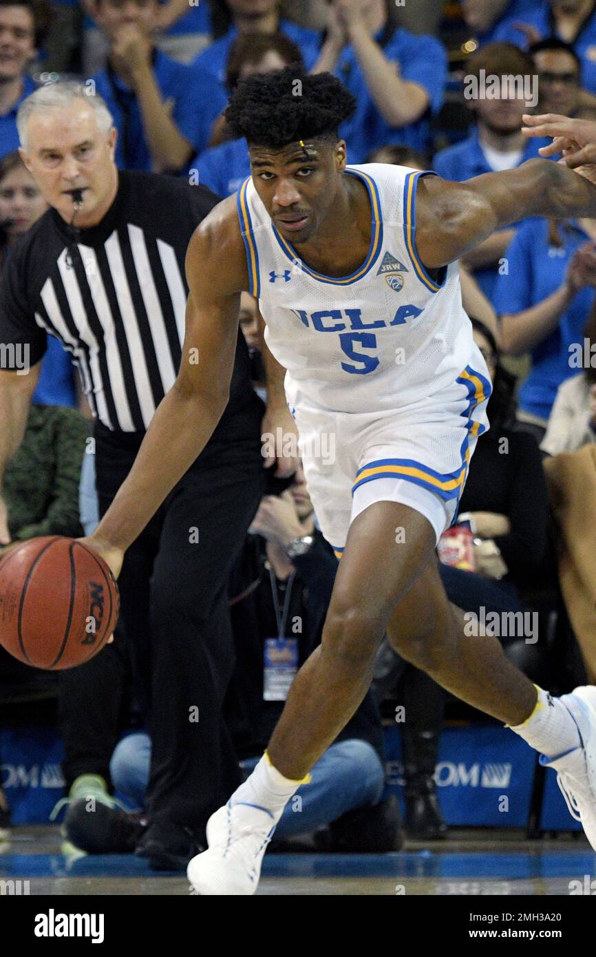 UCLA guard Chris Smith dribbles up court against Colorado during an ...