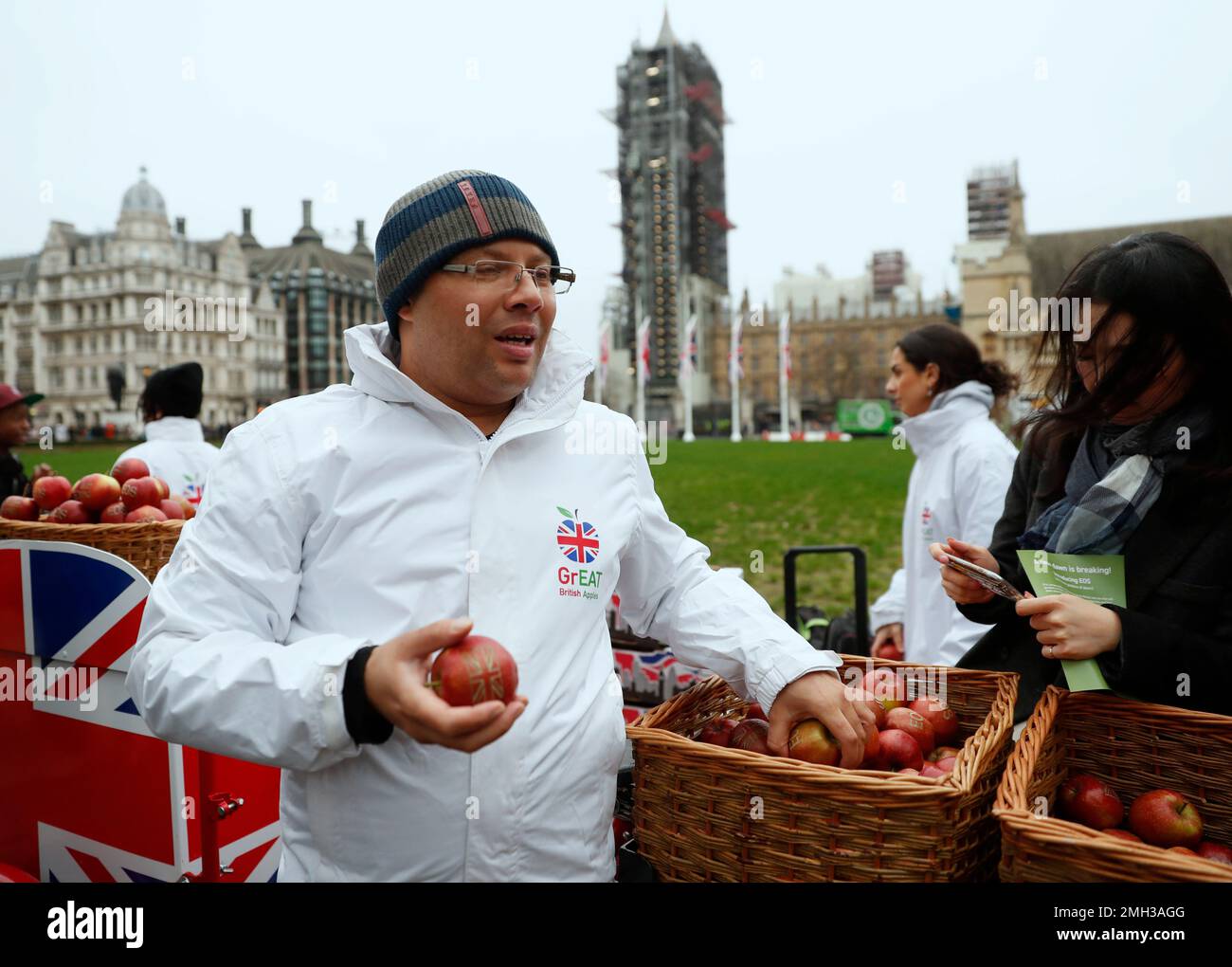 Tourists take pictures of Red Viking apples with the Union Jack on them ...
