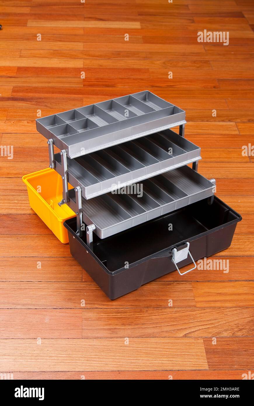 plastic box to organize tools; photo on wooden background Stock Photo ...
