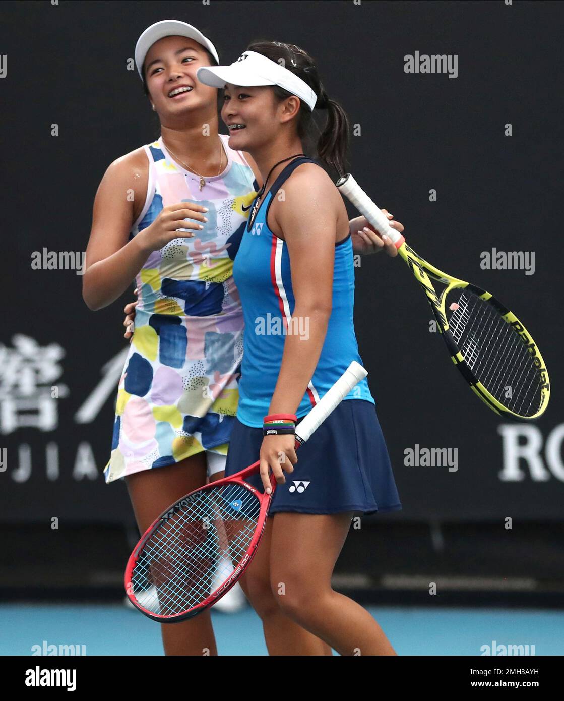 Alexandra Eala, left, of the Philippines and Indonesia's Priska Madelyn ...