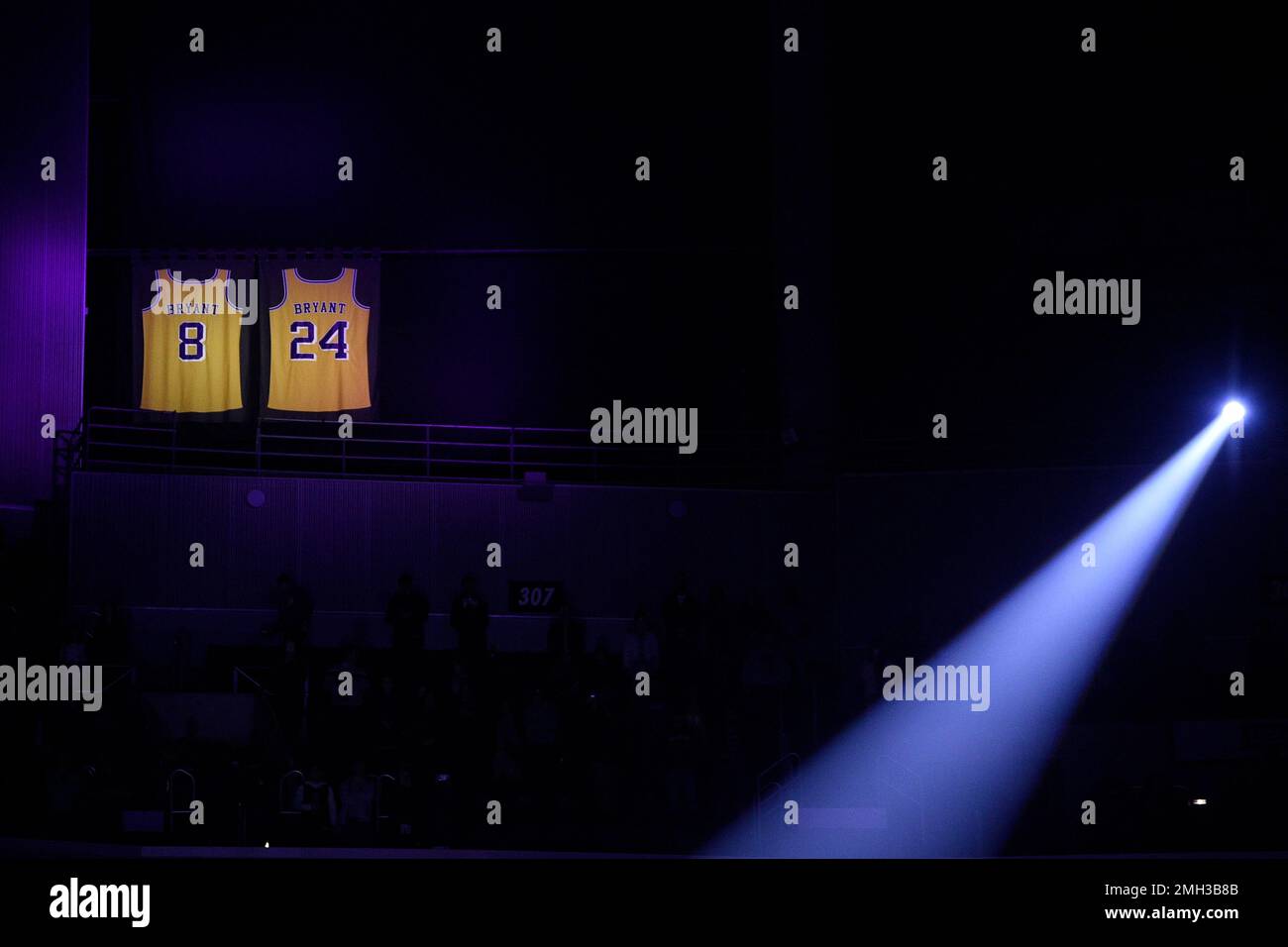 The retired jerseys of late Los Angeles Lakers' Kobe Bryant are lit ...