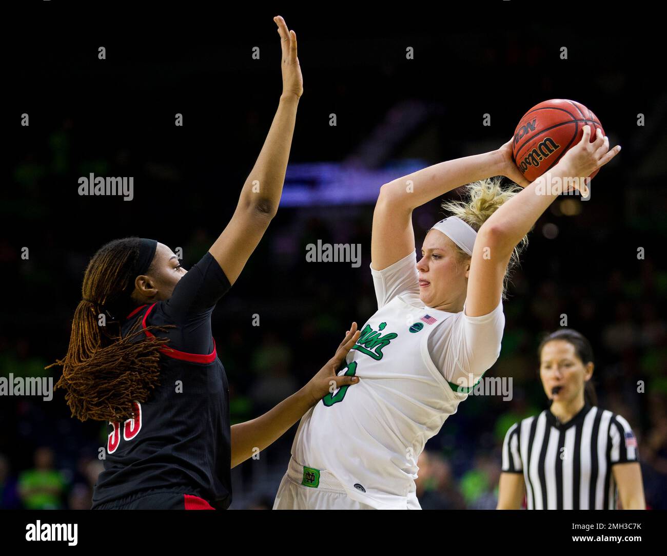 Notre Dame's Sam Brunelle, right, gets pressure from Louisville's ...