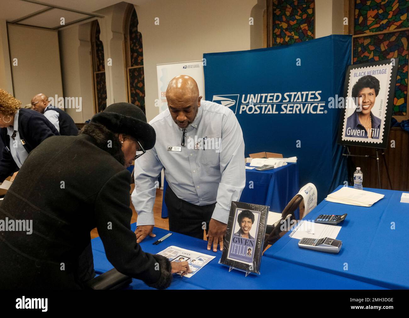 Guests purchase Gwen Ifill Black Heritage Commemorative Forever Stamps ...