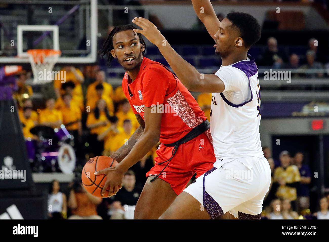Houston's DeJon Jarreau (3) tries to pass the ball around East Carolina ...