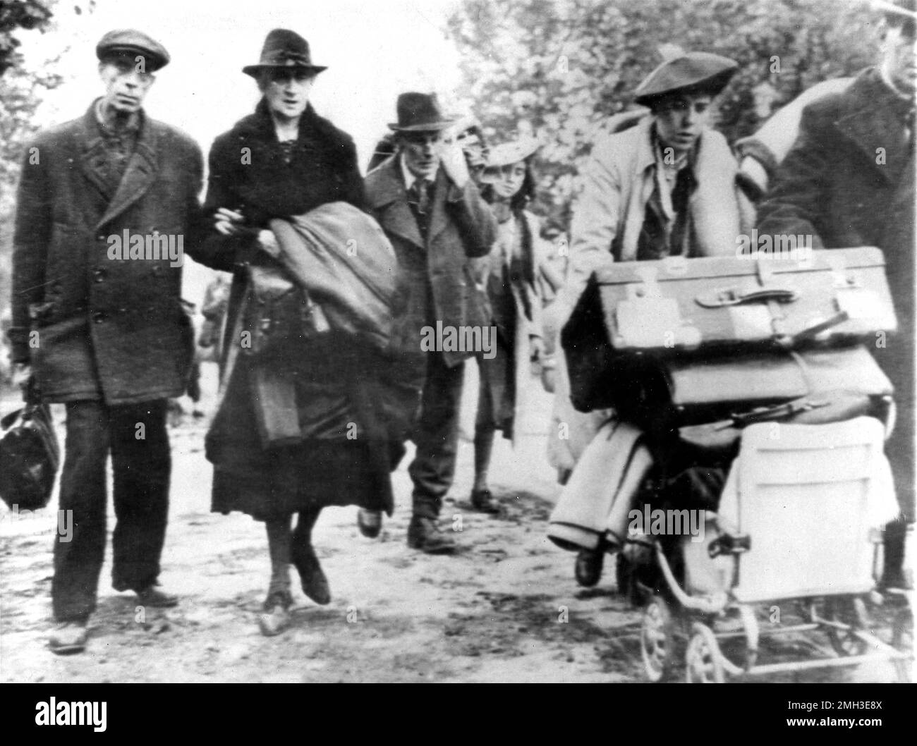 In this photo provided by the U.S. Army Signal Corps, grim-faced ...