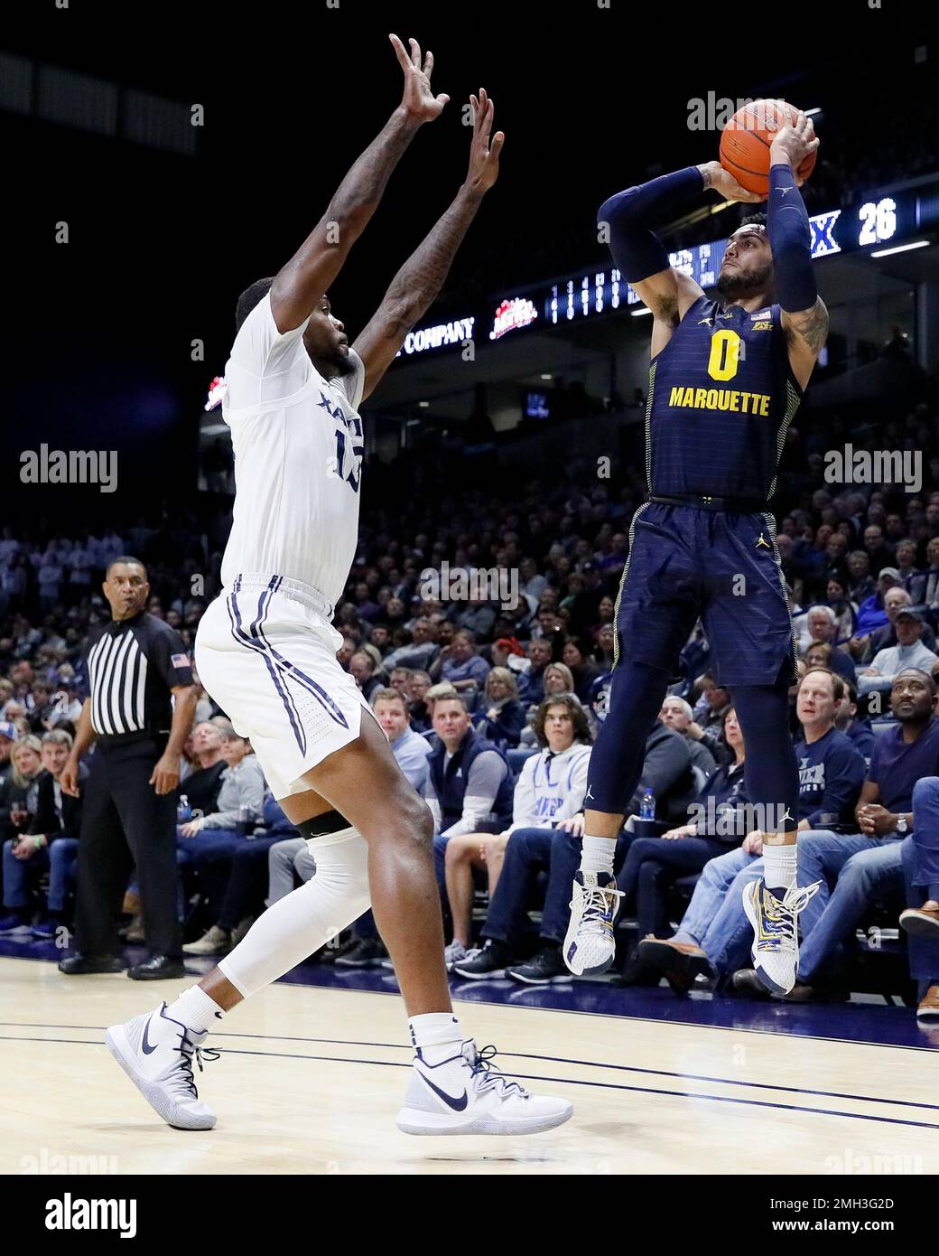 Marquette's Markus Howard (0) shoots over Xavier's Naji Marshall (13 ...