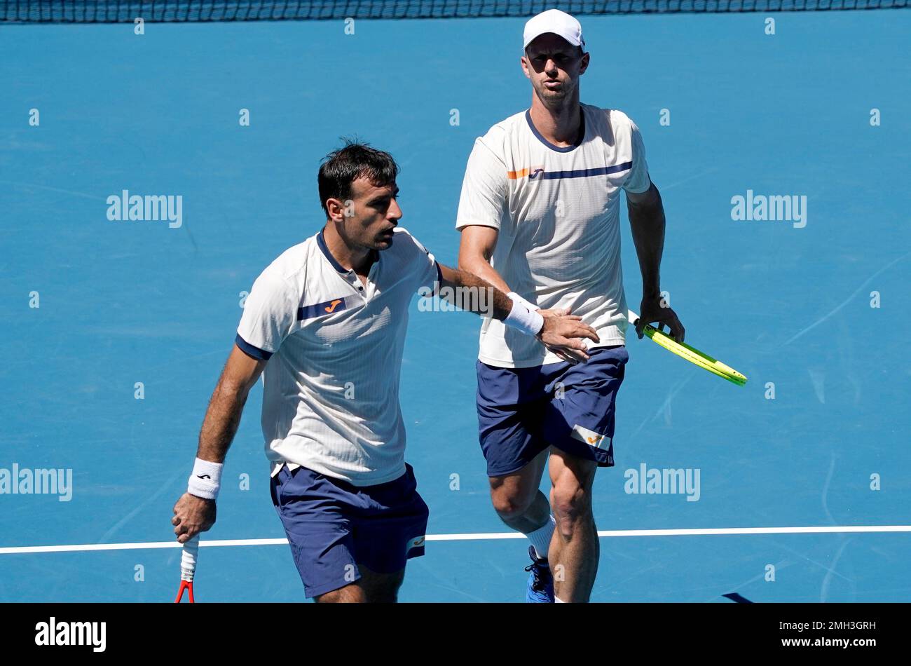 Slovakia's Filip Polasek, right, and Croatia's Ivan Dodig react during ...