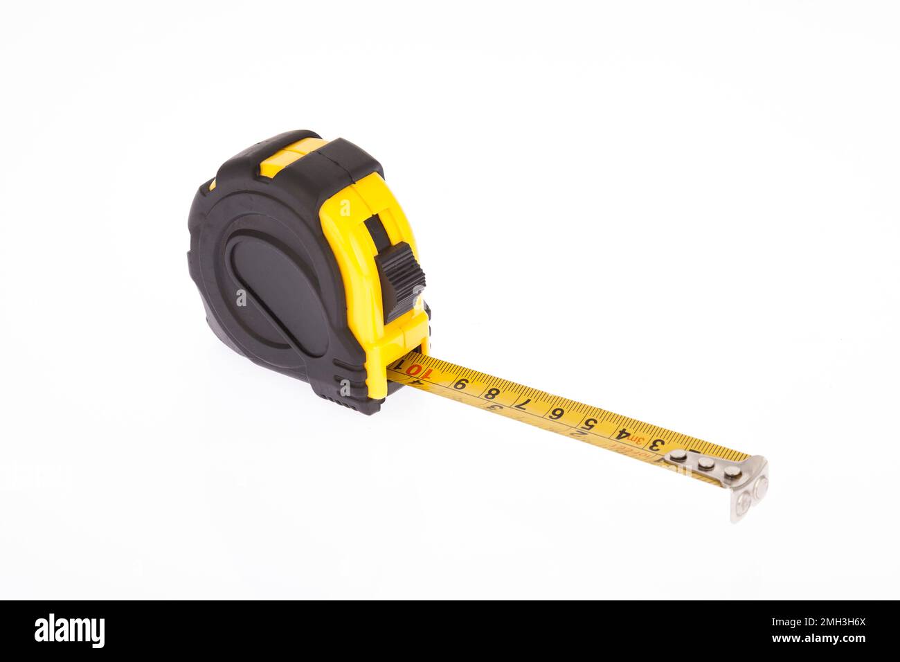 Yellow flexometer with black on white background Stock Photo - Alamy