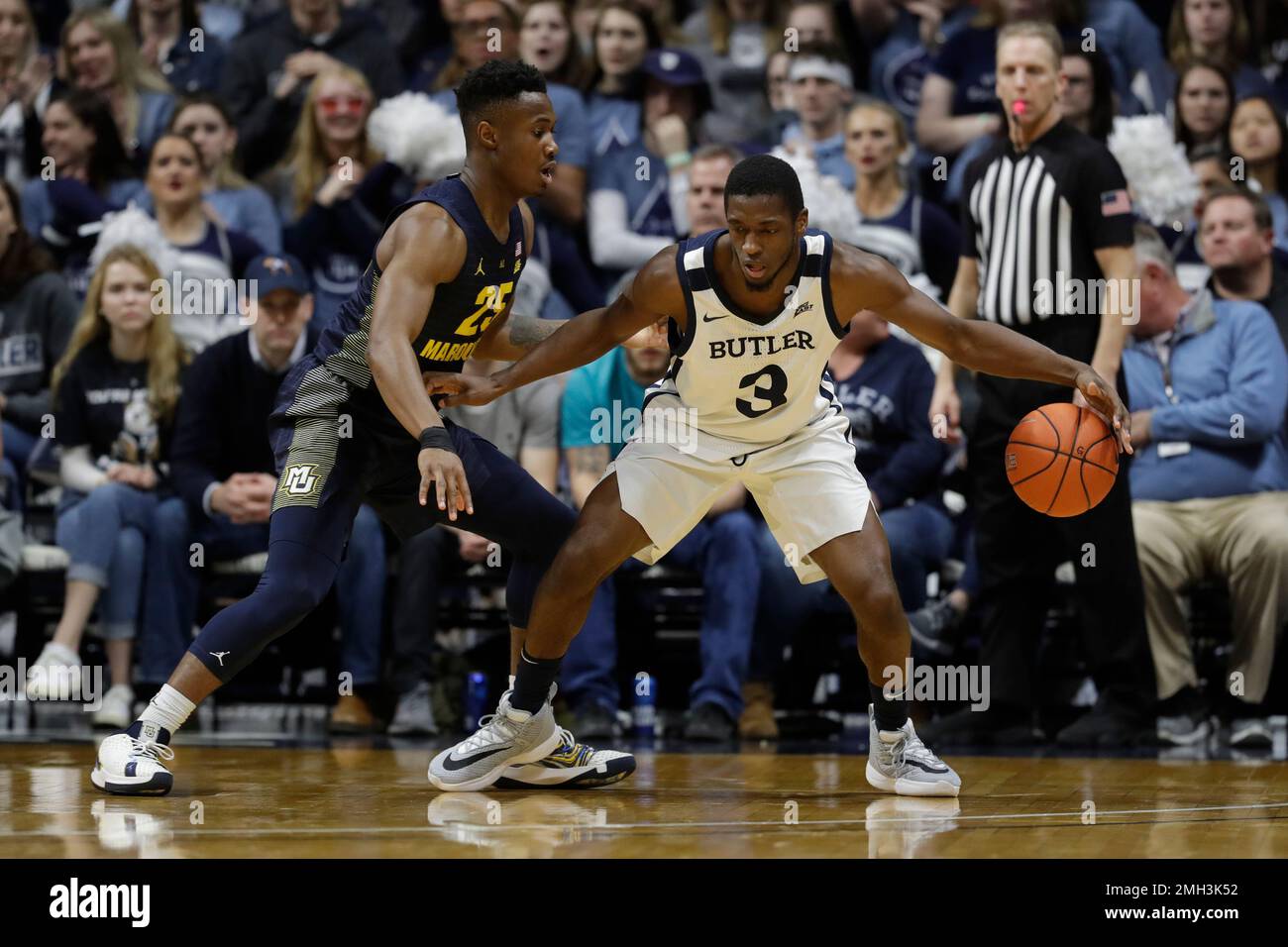 Butler's Kamar Baldwin (3) is defended by Marquette's Koby McEwen (25 ...