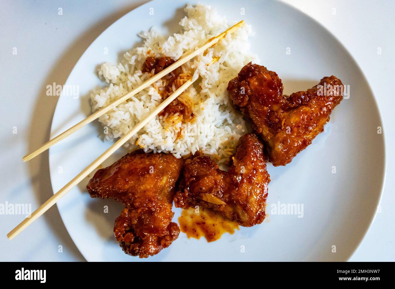 Korean chicken wings with Mega sauce and rice Stock Photo - Alamy