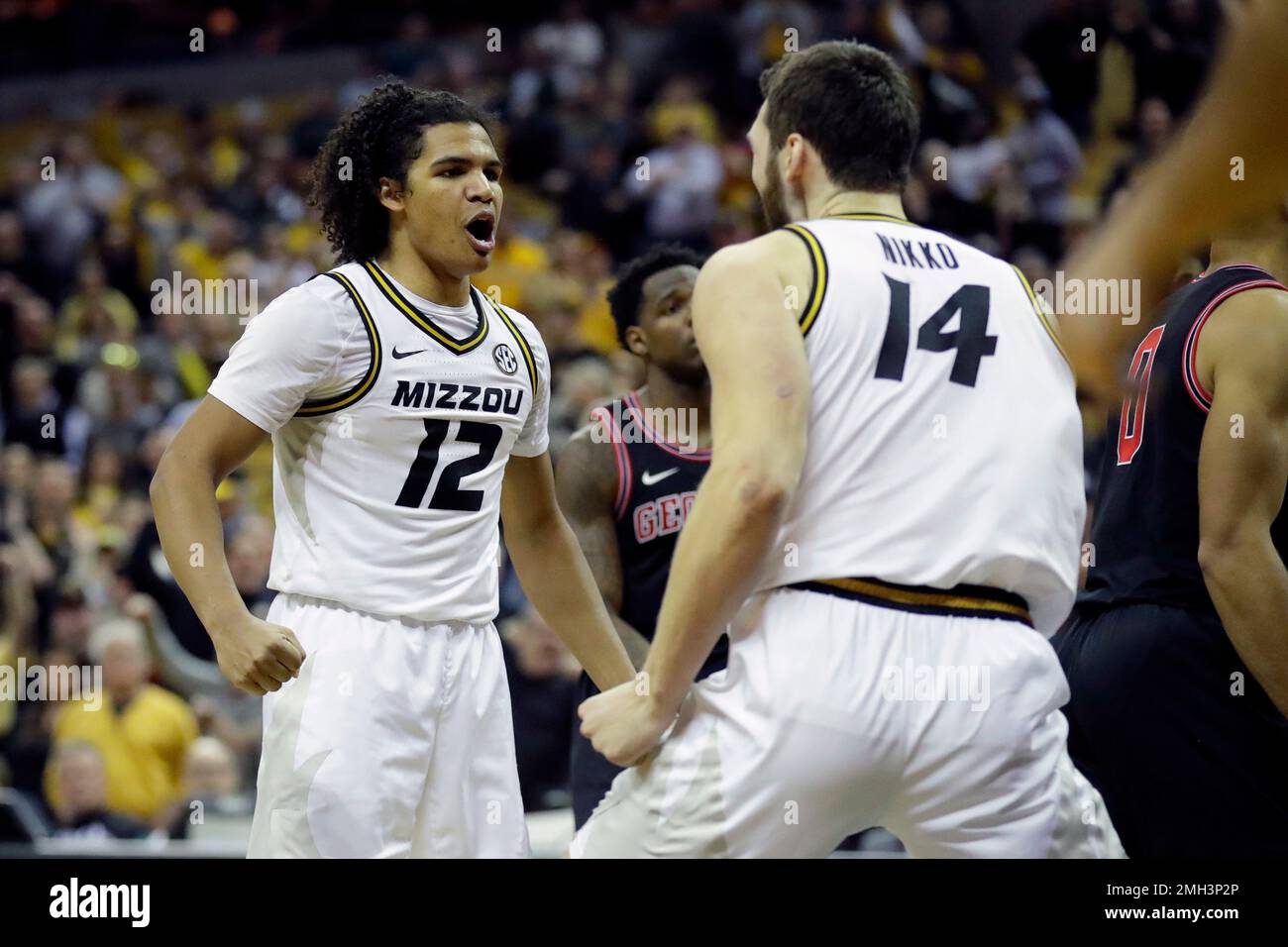 Missouri's Dru Smith (12) and Reed Nikko (14) celebrate late in the ...