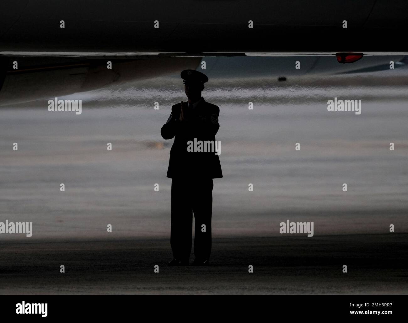 An Airman keeps warm prior to President Donald Trump arrival to a ...