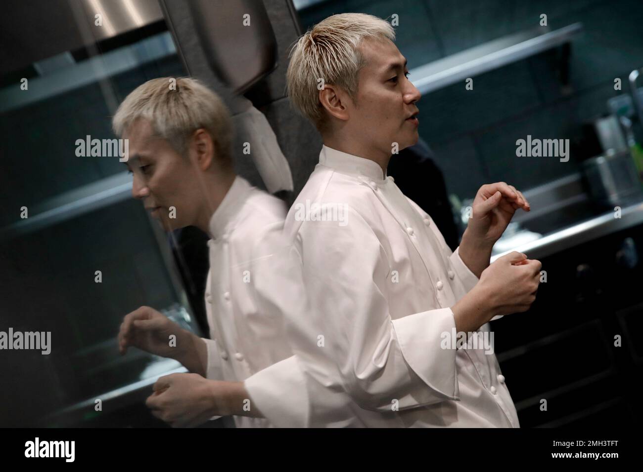 Japan's Kei Kobayashi, Chef of the restaurant Kei, speaks to reporters ...
