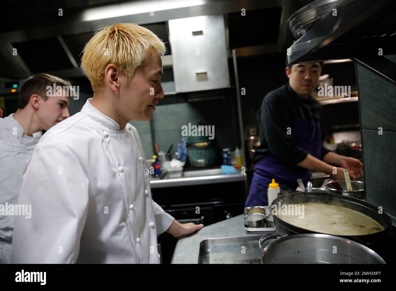 Japan's Kei Kobayashi, Chef of the restaurant Kei, works in his ...