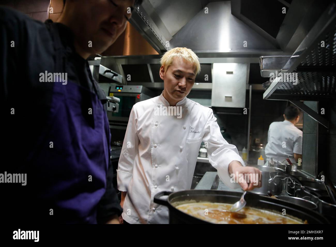 Japan's Kei Kobayashi, Chef of the restaurant Kei, works in his ...