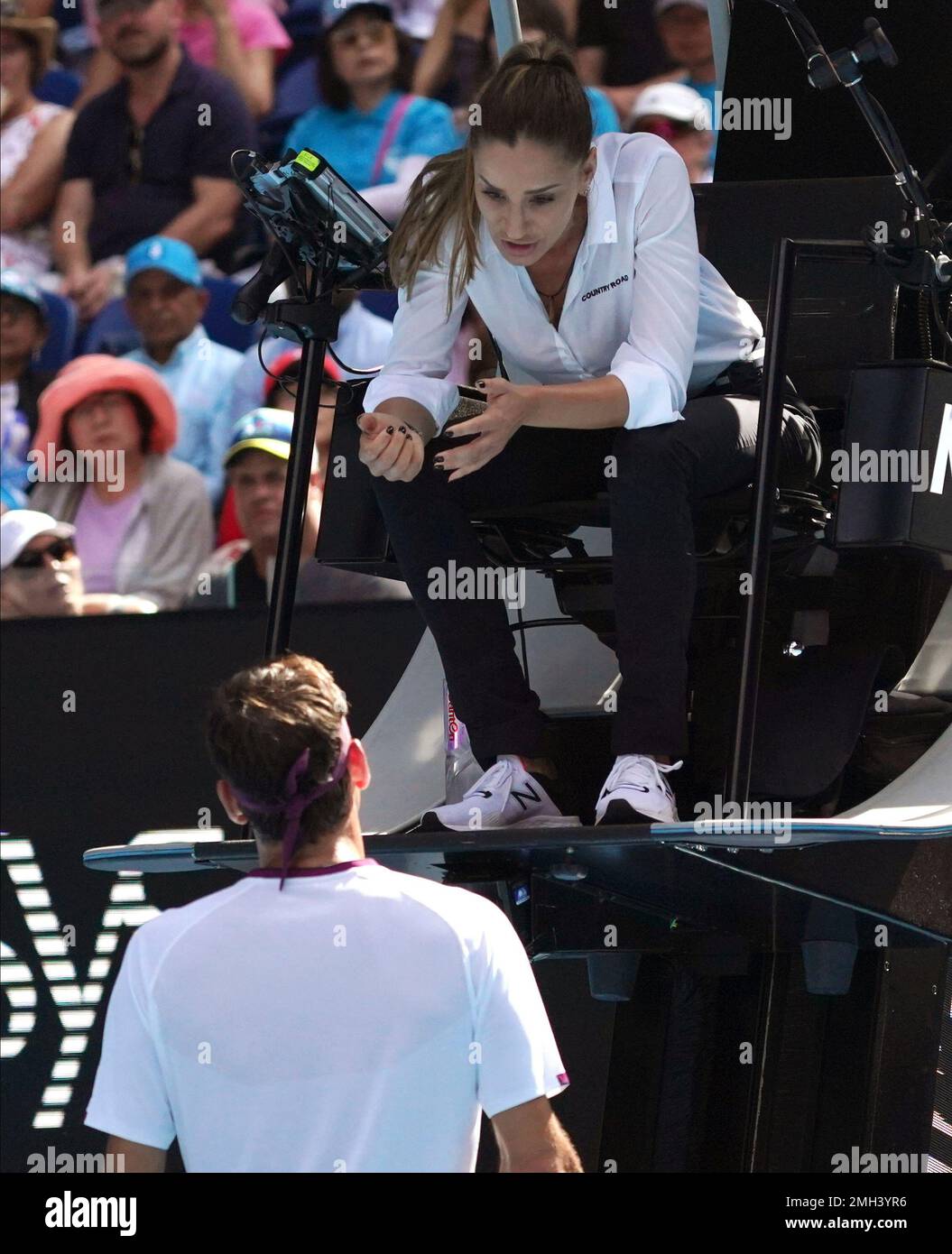 Chair umpire Marijana Veljovic talks with Switzerland's Roger Federer ...
