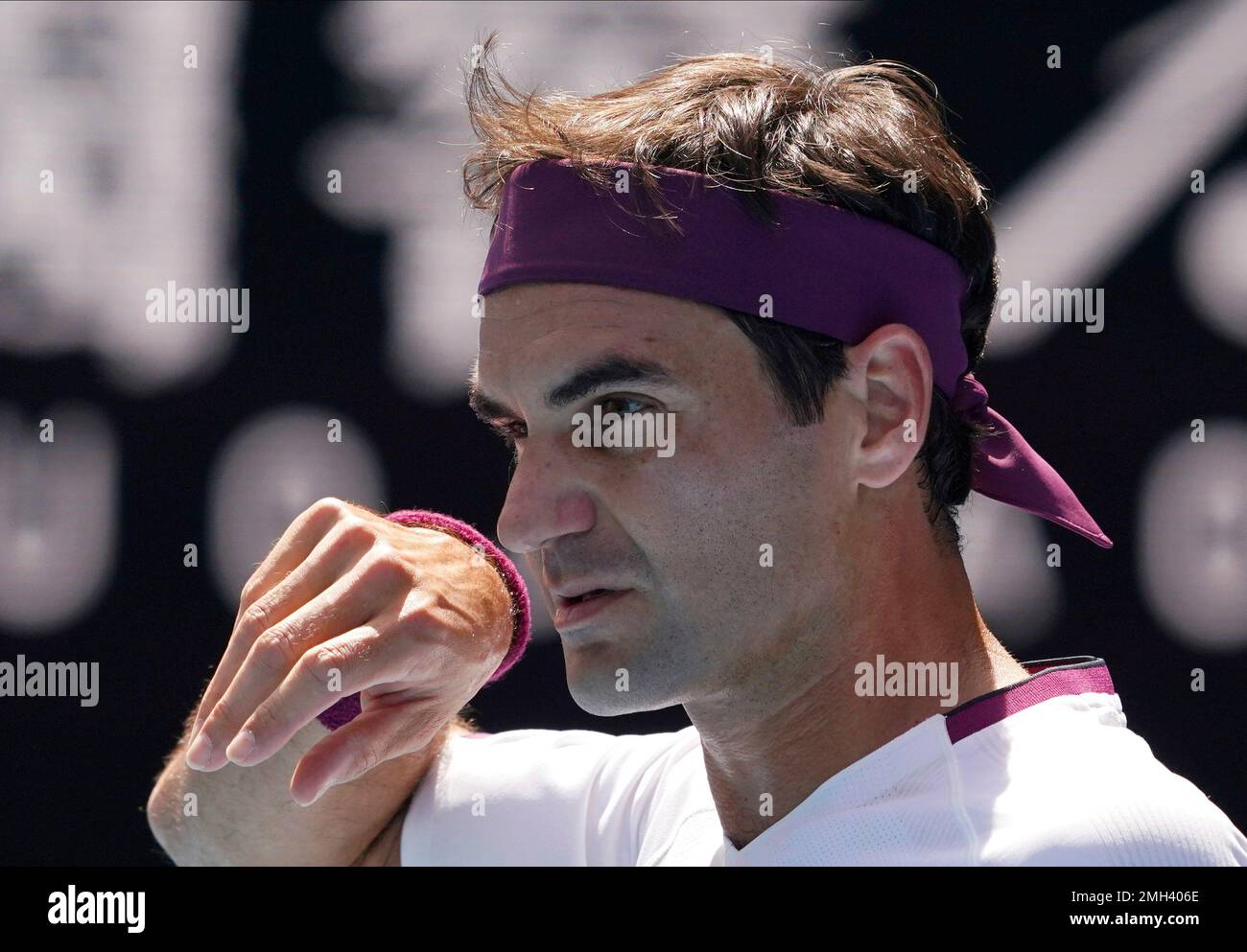 Switzerland's Roger Federer wipes the sweat from his face during his ...