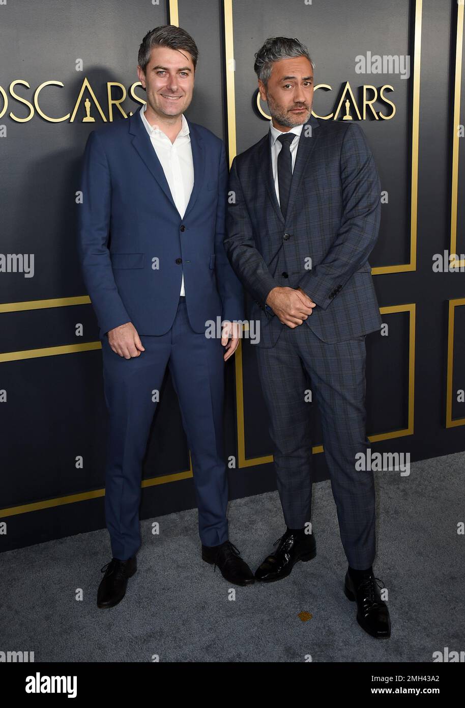 Carthew Neal, left, and Taika Waititi arrive at the 92nd Academy Awards ...