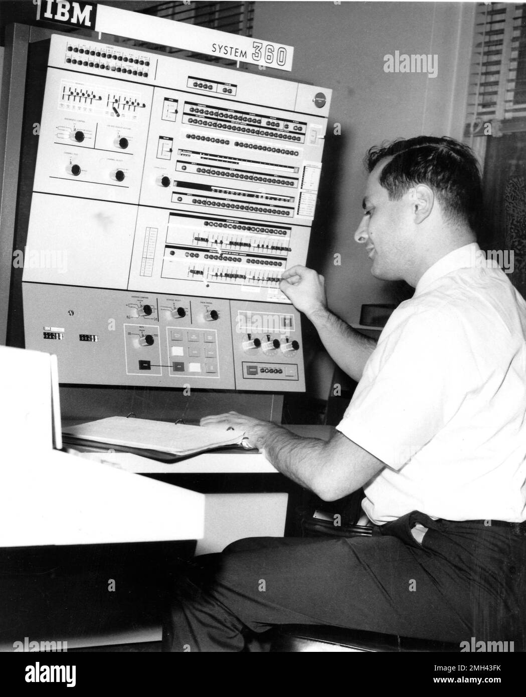 AP programmer Herb Leiner at AP's New York headquarters, circa 1966, at the IBM 360 computer ...