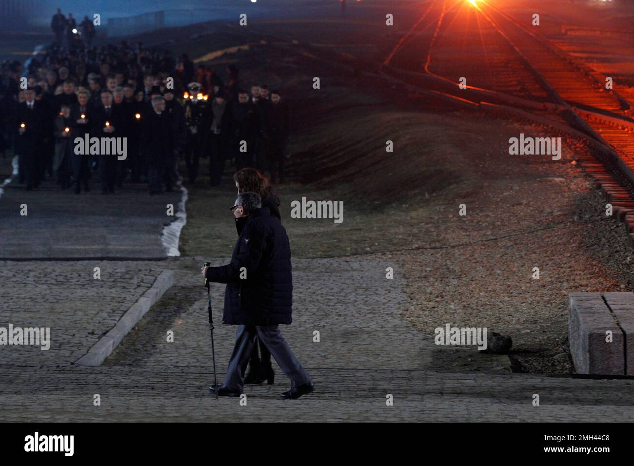 Holocaust survivor Marian Turski, center, walks to meet dignitaries ...