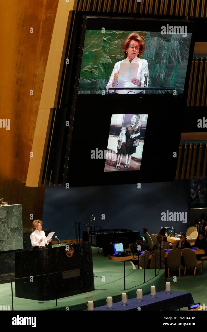Holocaust survivor Irene Shashar speaks while a photo of herself and ...