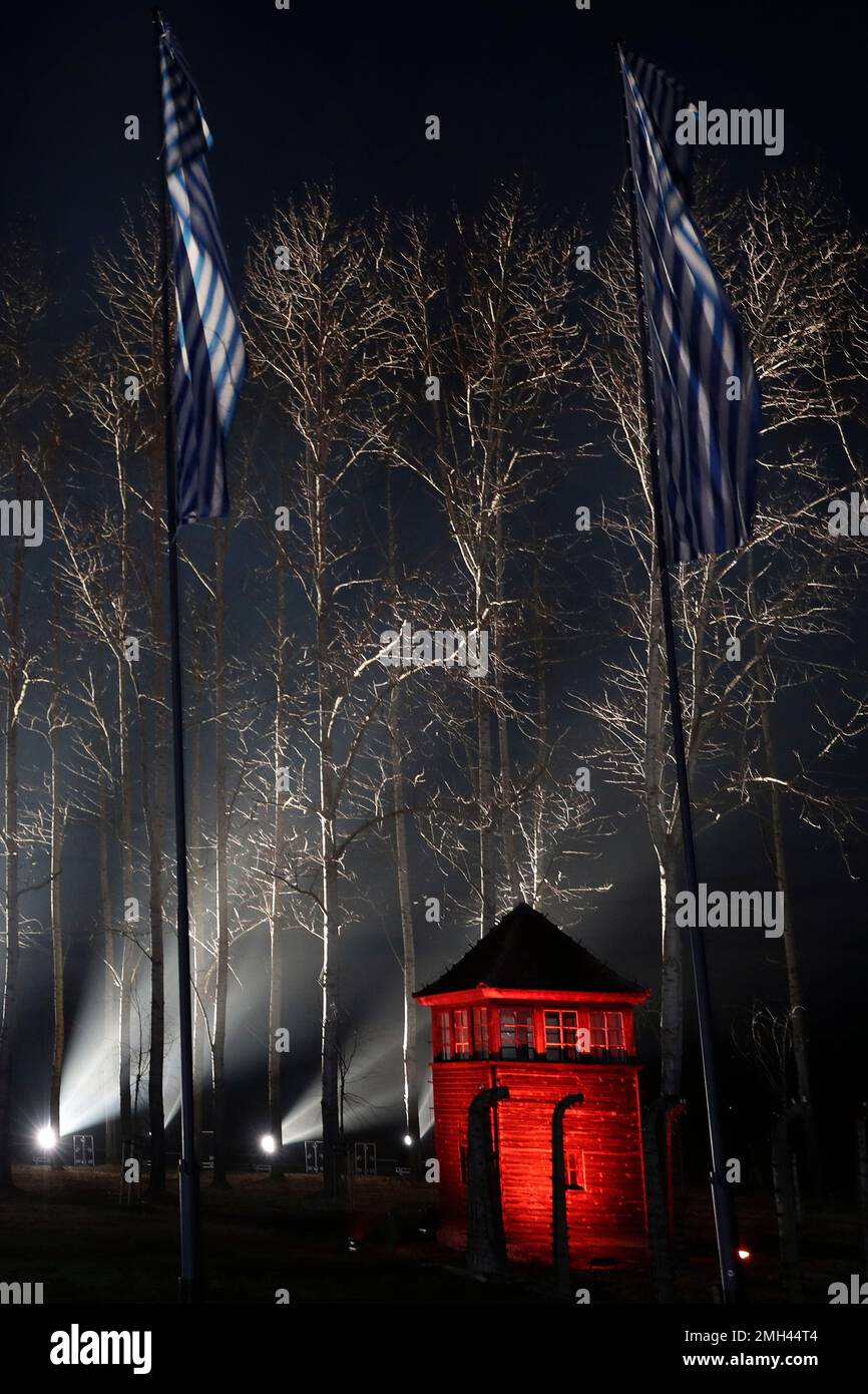 Flags with the stripes of the prison uniforms of Nazi death camps fly ...