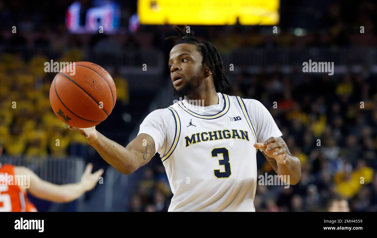 Michigan guard Zavier Simpson takes the inbound pass during the first ...