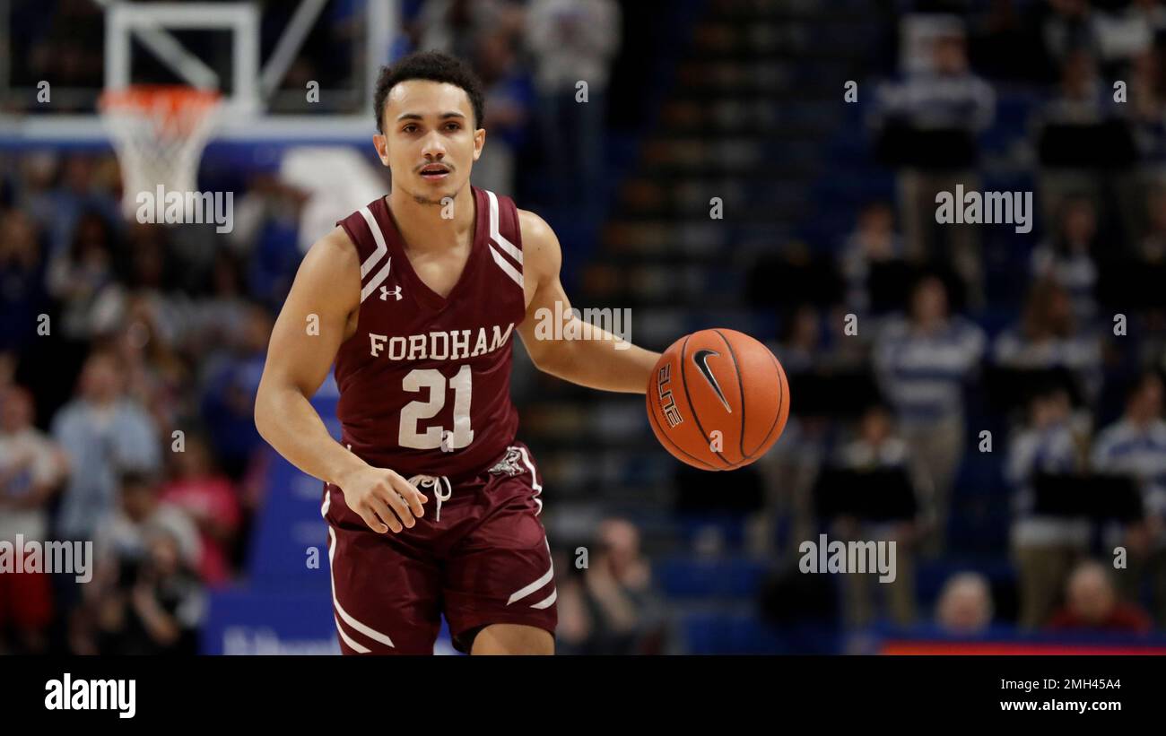 Fordham's Josh Colon brings the ball down the court during the first ...