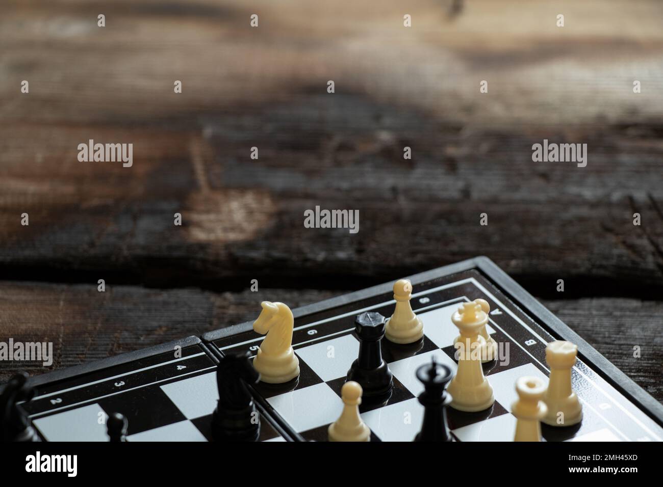 chess stand on an old black wooden table, chess game, chess pieces ...