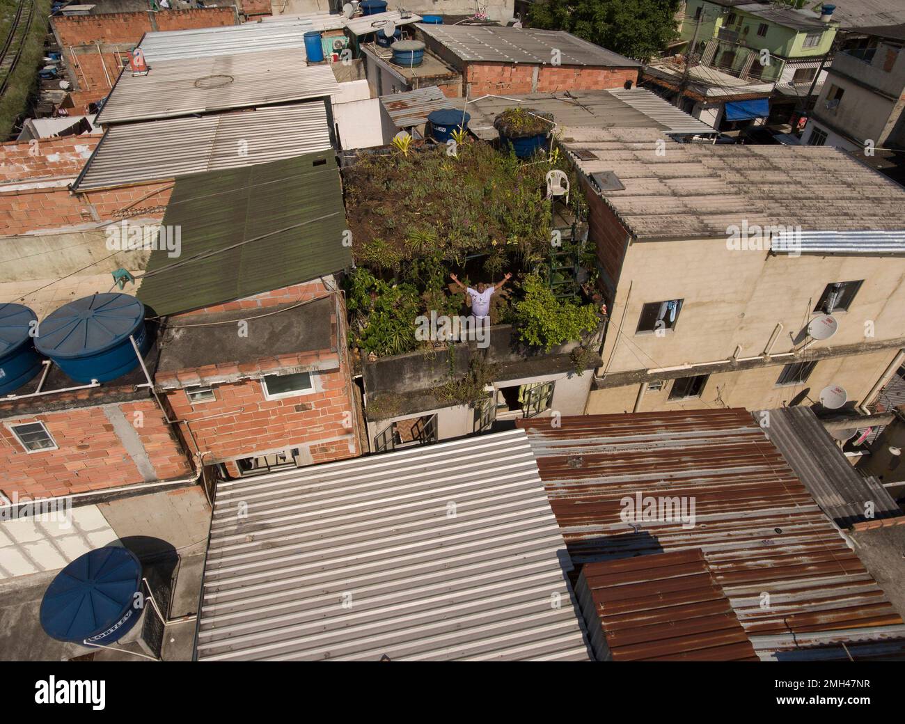 In this Jan.10, 2020 photo, Luis Cassiano shows his green roof at his ...