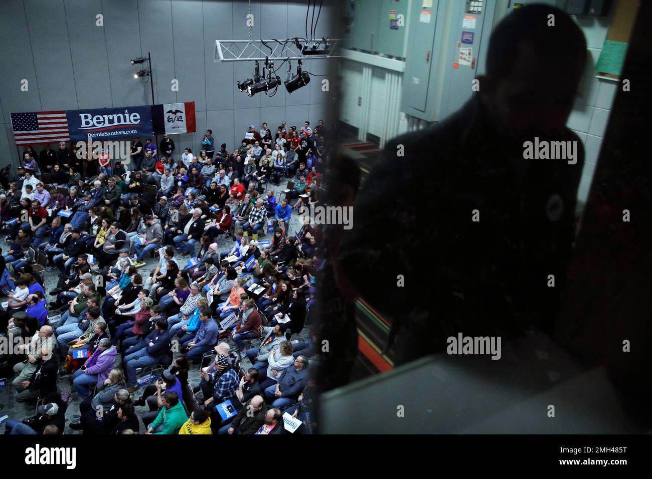 People listen as democratic presidential candidate Sen. Bernie Sanders ...