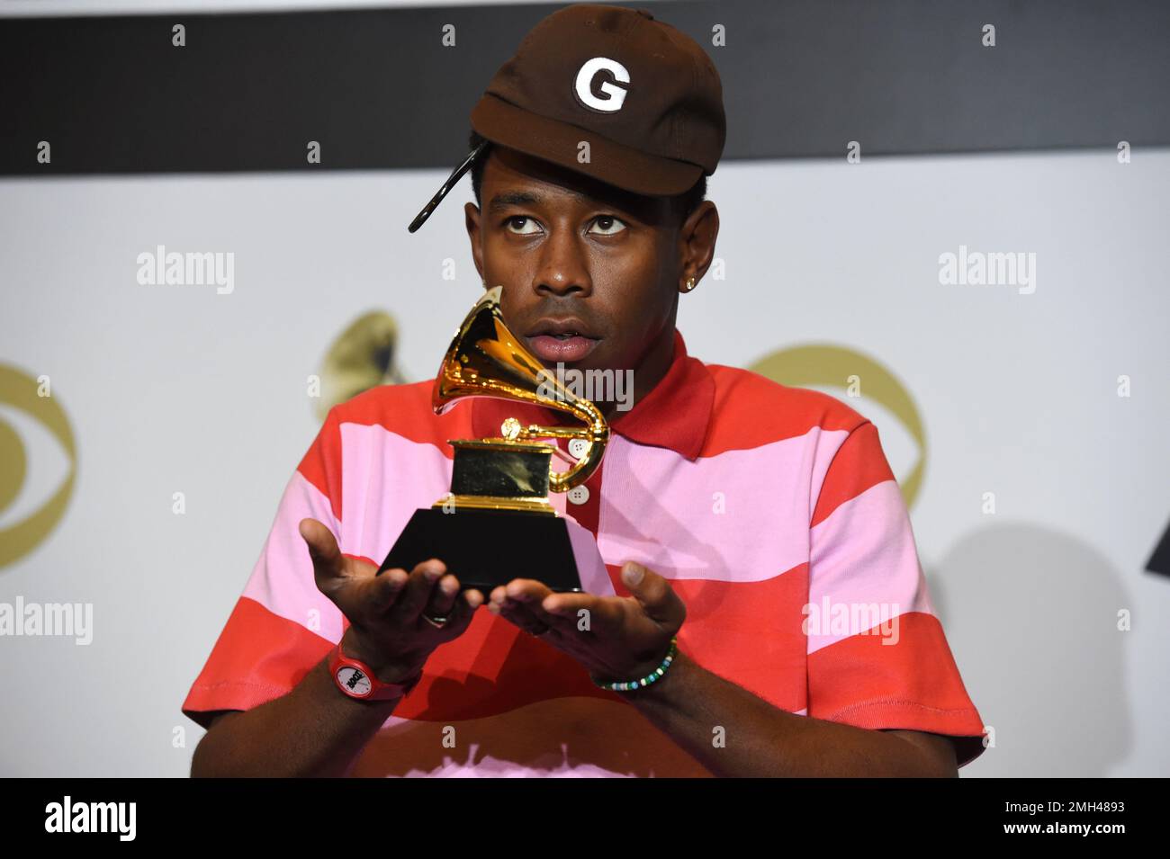 Tyler, The Creator poses in the press room with the award for best rap ...