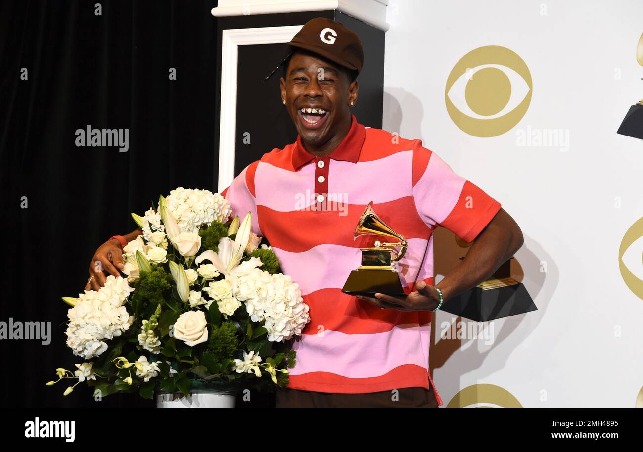 Tyler, The Creator poses in the press room with the award for best rap ...