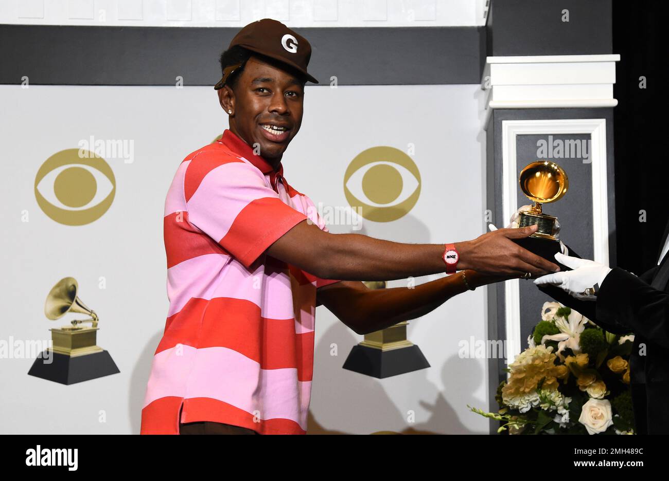 Tyler, The Creator poses in the press room with the award for best rap ...