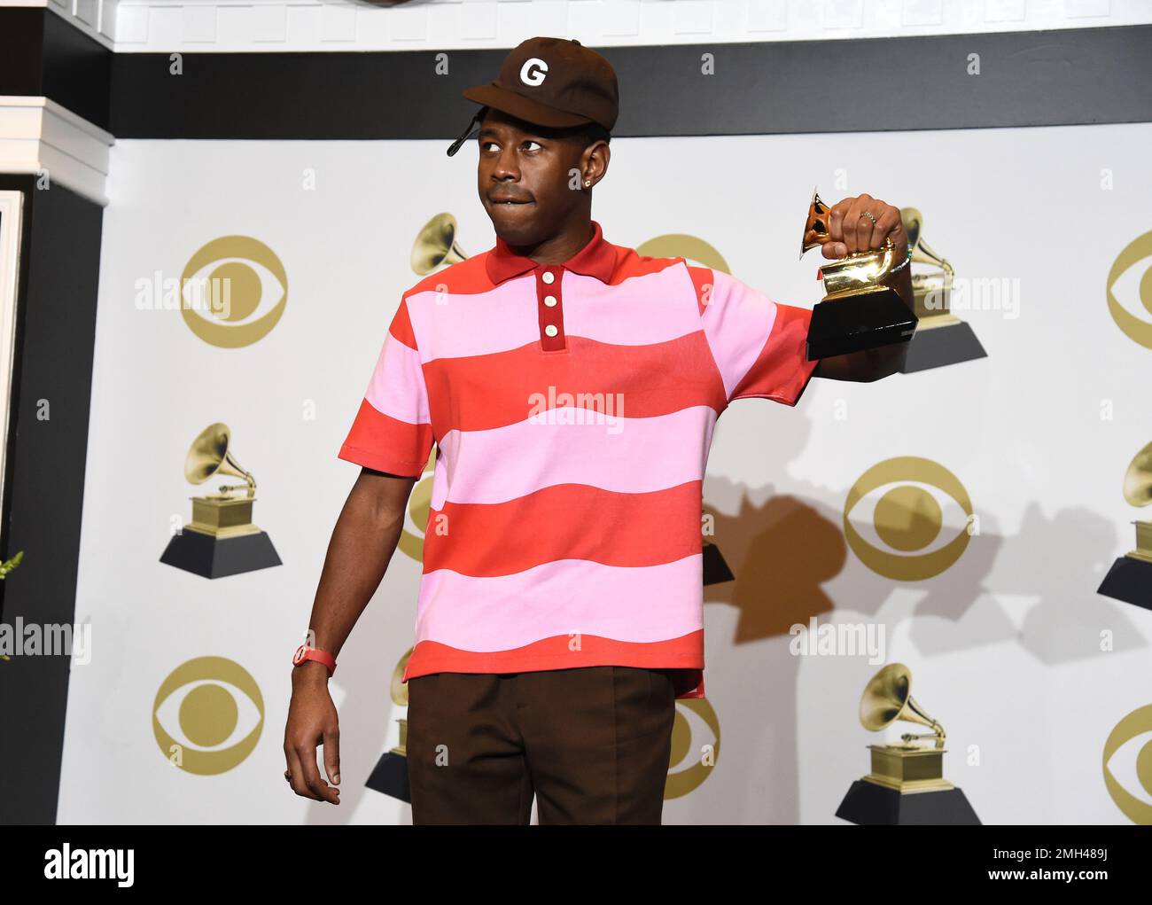 Tyler, The Creator poses in the press room with the award for best rap ...