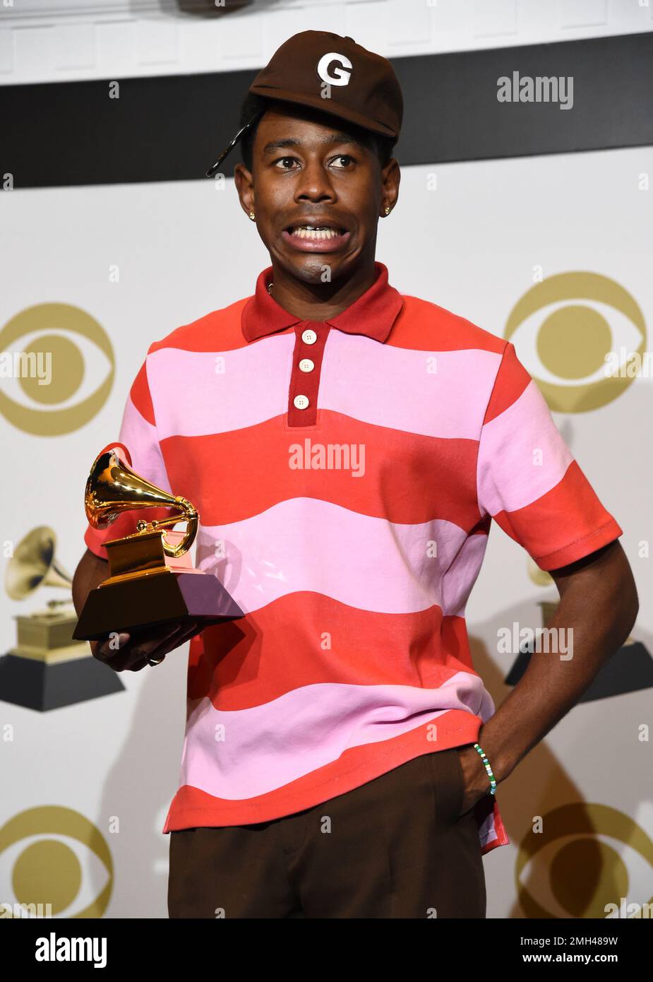 Tyler, The Creator poses in the press room with the award for best rap ...
